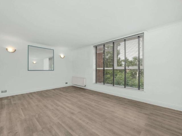 Spacious two double bedroom, two bathroom second floor apartment set within the sought after Queens Court development, offering residents parking and a garage