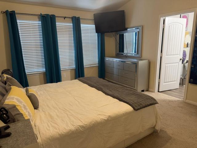 Spacious bedroom and private bathroom with workout