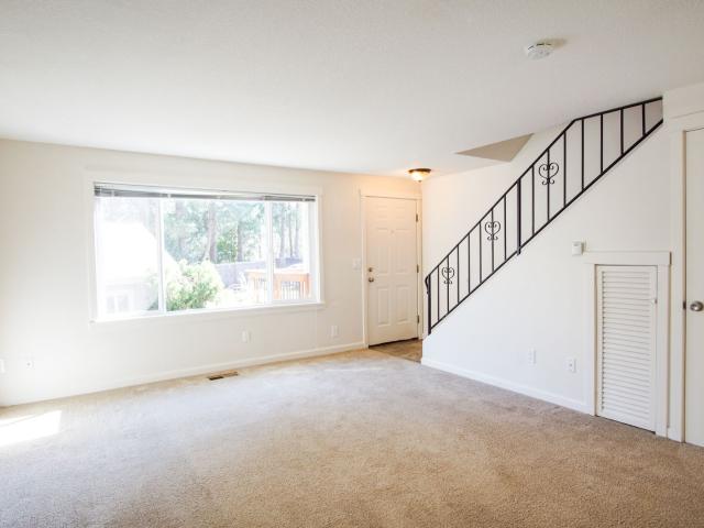 Spacious Corner Townhome with Private Patio + Parking!