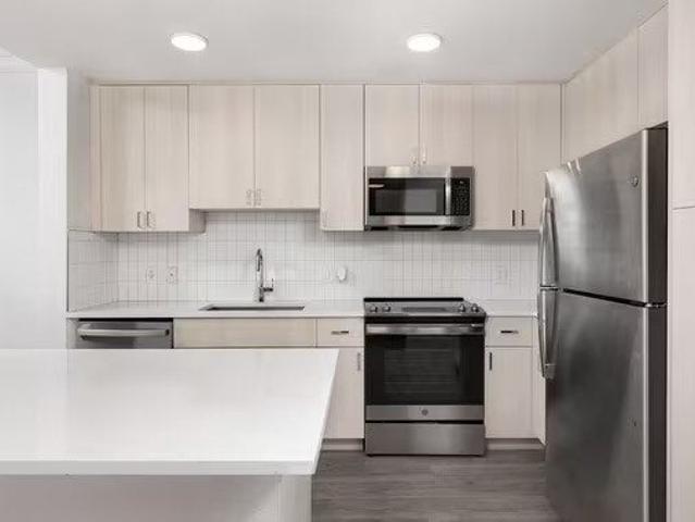Spacious Ensuite Room with amenities and utilities