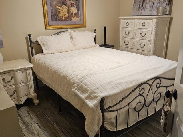 Spacious furnished bedroom and bath