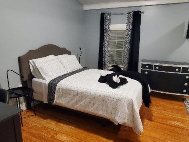 Spacious furnished room with sitting area
