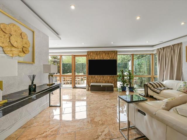 Spacious ground floor apartment with exceptional private garden, offering over 1,200 sq ft of lateral living in a modern Kilburn development