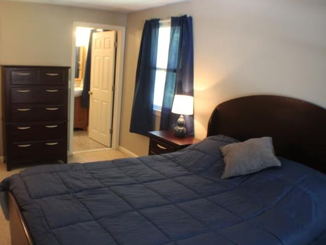 Spacious master suite room with a private bathroom