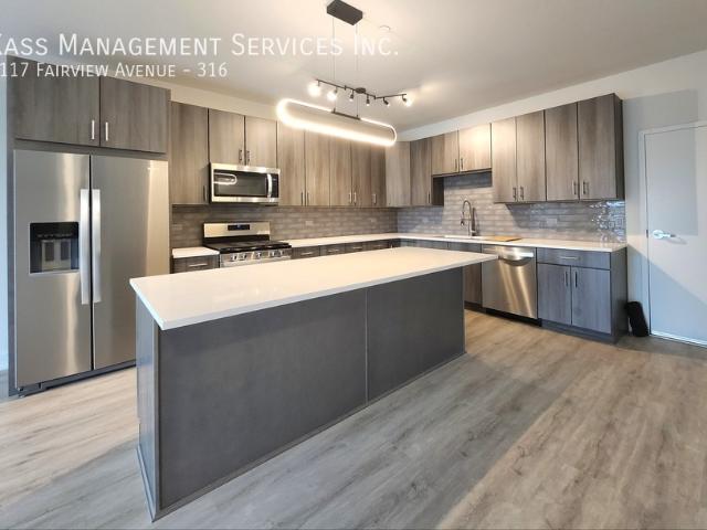 Spacious New construction 2 bed 2 bath with Patio & In Unit Laundry in Downers Grove
