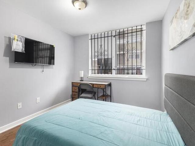 Spacious newly renovated duplex featuring private ensuite bathrooms, a personal TV, high speed Wi Fi, reach in closet, and personal work space