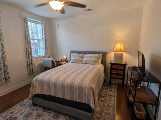 Spacious private bedroom with an attached bathroom