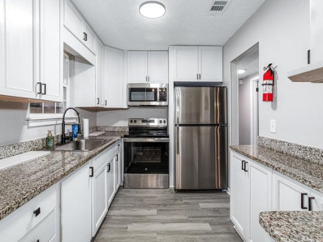 Sweetwater home with screened patio and large back