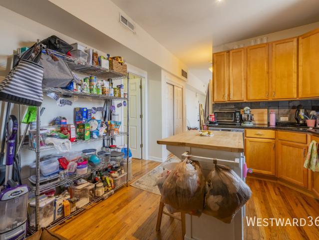 Steps to 606 Trail and Blue Line! Laundry In unit and Garage Parking Available!