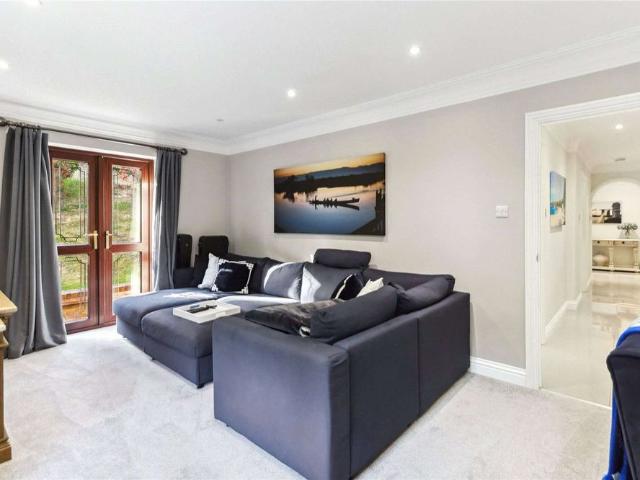 Striking contemporary residence, gracefully positioned on an elevated one acre plot on St George's Hill private estate