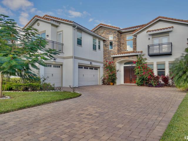 Stunning 4/5 Executive Pool Home in the Guard Gated Golf Course Community of Eagle Creek Orlando!