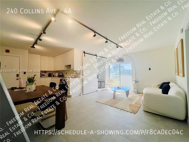 Stunning Two Bedroom, One Bathroom Corner Condo: Fully Furnished, Flooded With Natural Light & One Block From The Ocean