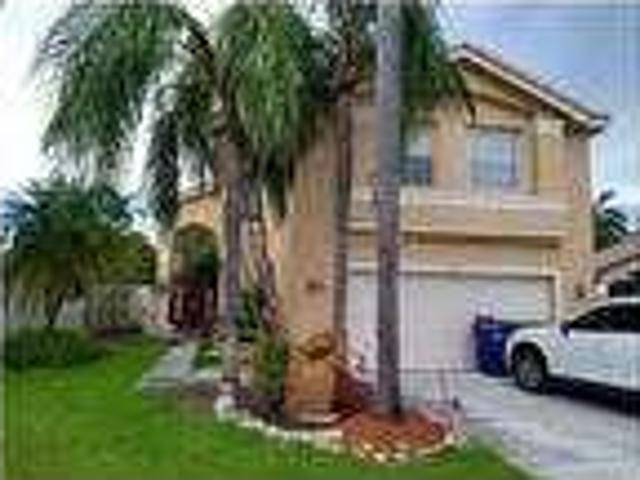 Stunning two story 4BR home with a pie shape fenced in garden and covered