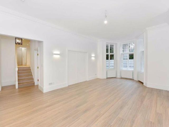 Stylish lateral apartment with private patio on a prime tree lined Primrose Hill road