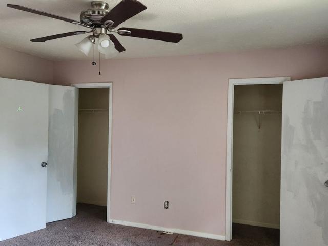 Sunny bedroom with two windows